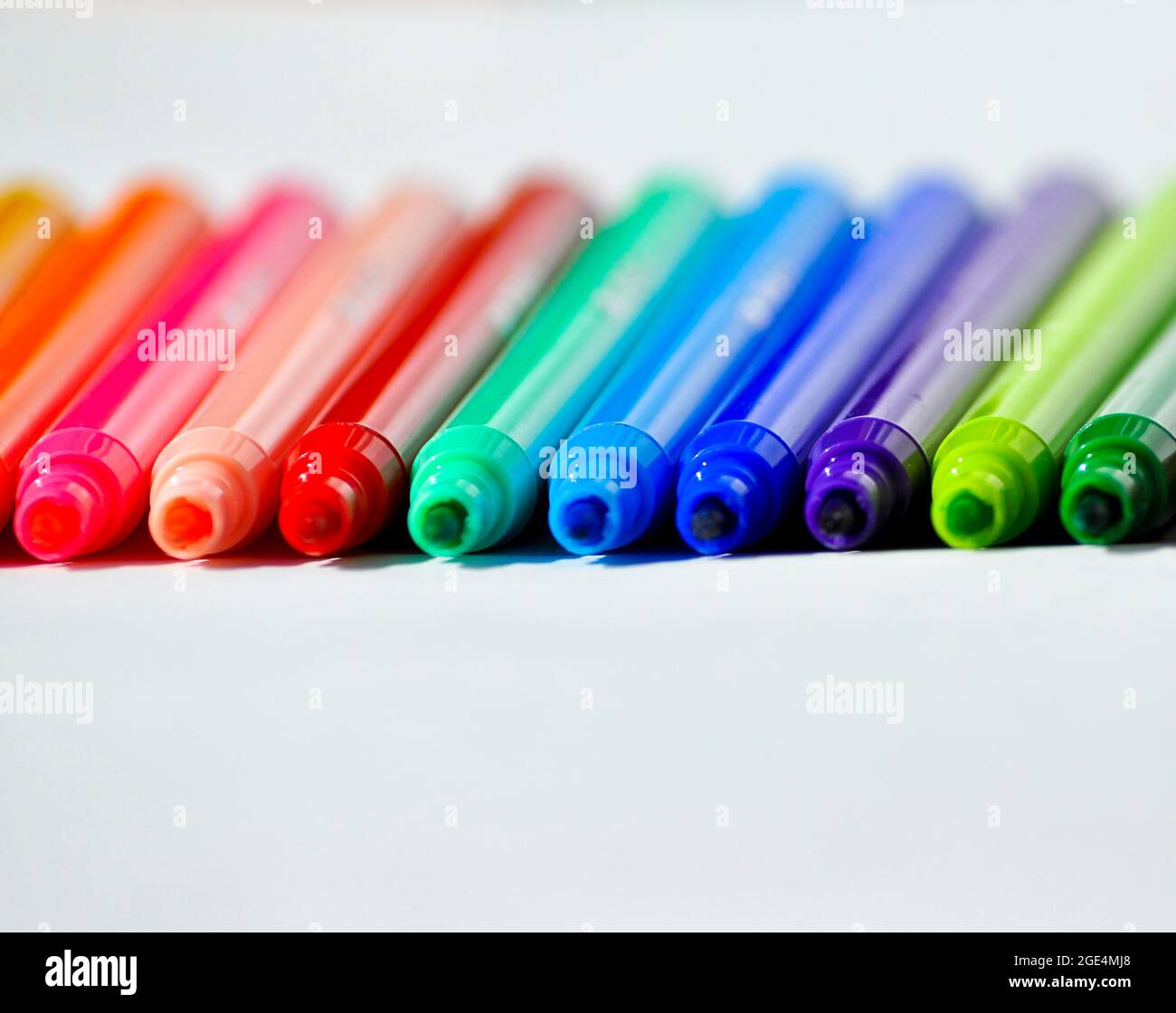 Rainbow colour of felt tip pens without lids on. Colours are lined up ...