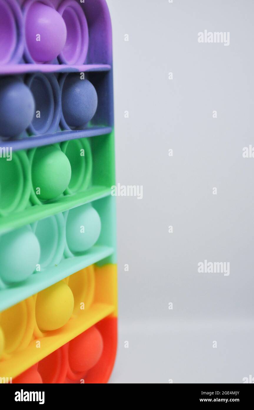 Colourful push pop - a novelty, silicone toy that helps relieve stress ...