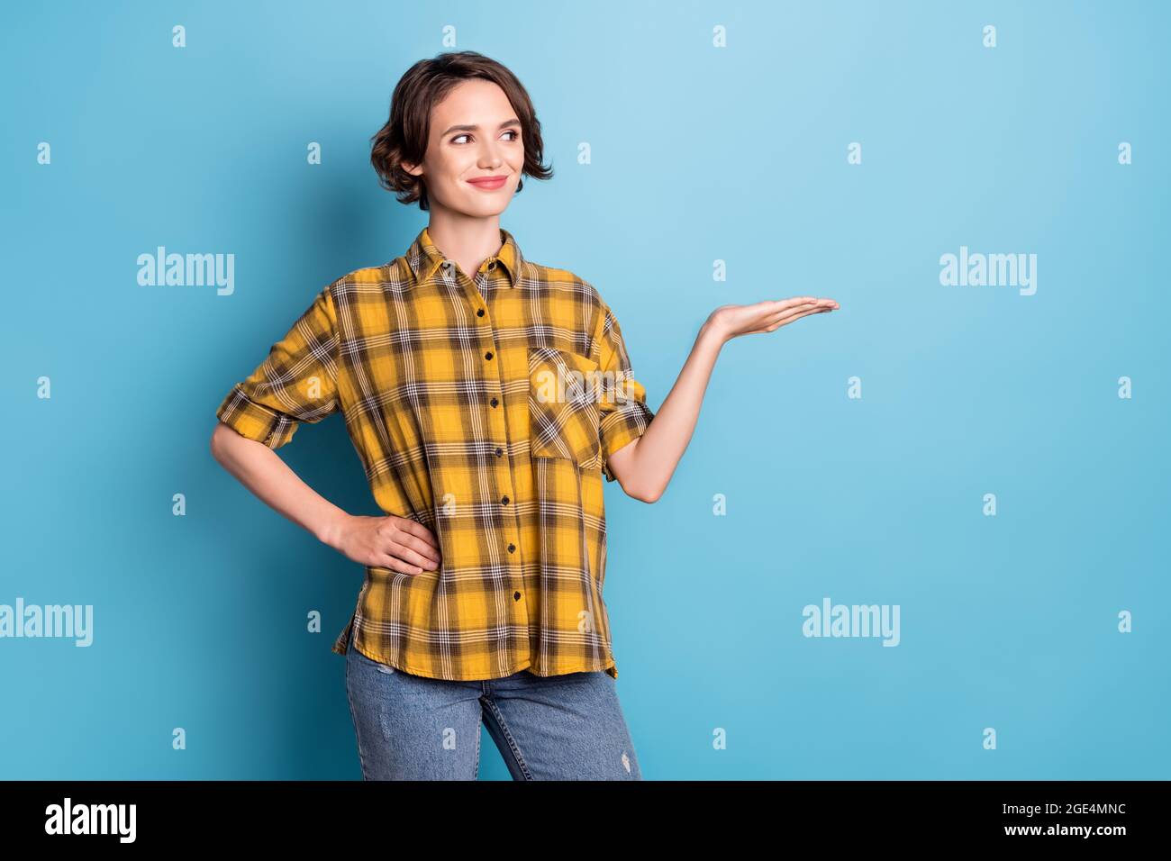 Photo of promoter lady hand demonstrate empty space look side wear ...
