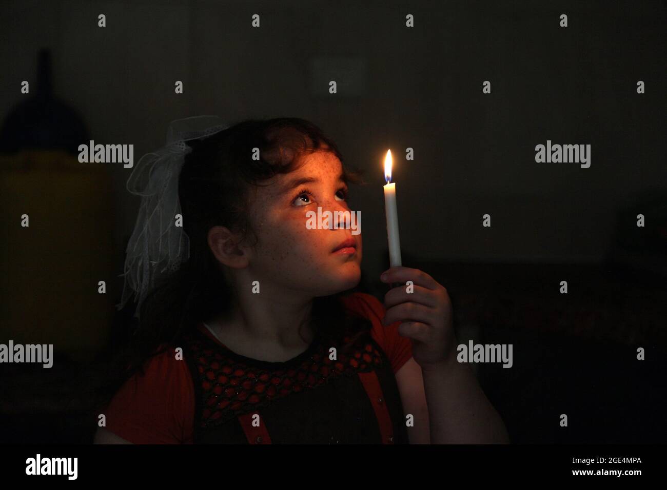 Portrait of a Palestinian Child holding a candle. Gaza City Stock Photo ...