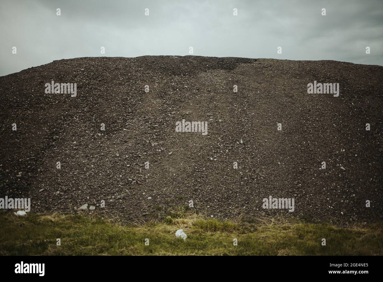 Small brown rocky hill under the glooms sky Stock Photo - Alamy