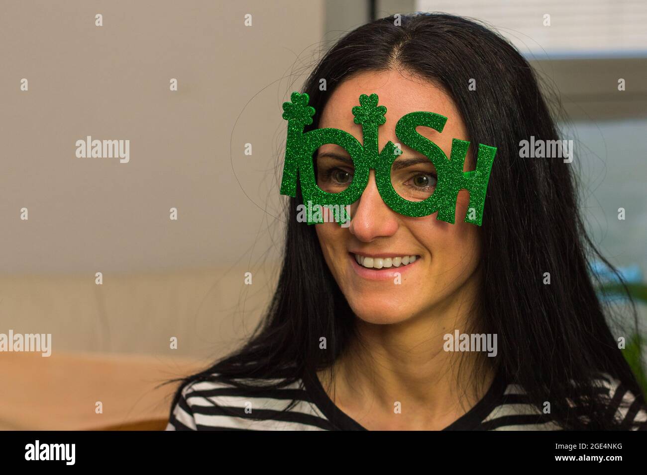 Smiling Spanish girl with a funny mask on her eyes Stock Photo - Alamy