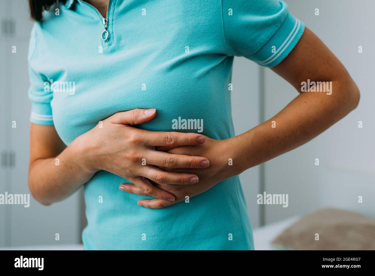 Woman with chest pain hi-res stock photography and images - Alamy