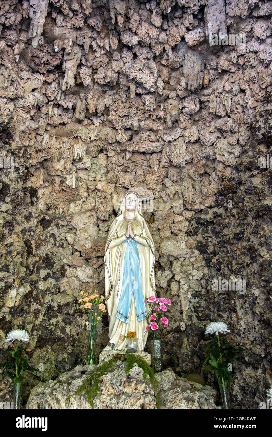 The natural altar with a statue of the Virgin Mary inside the chapel ...