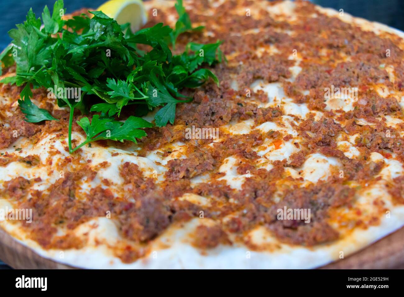 Turkish pizza lahmacun. Lahmajun with herbs and lemon. Traditional ...