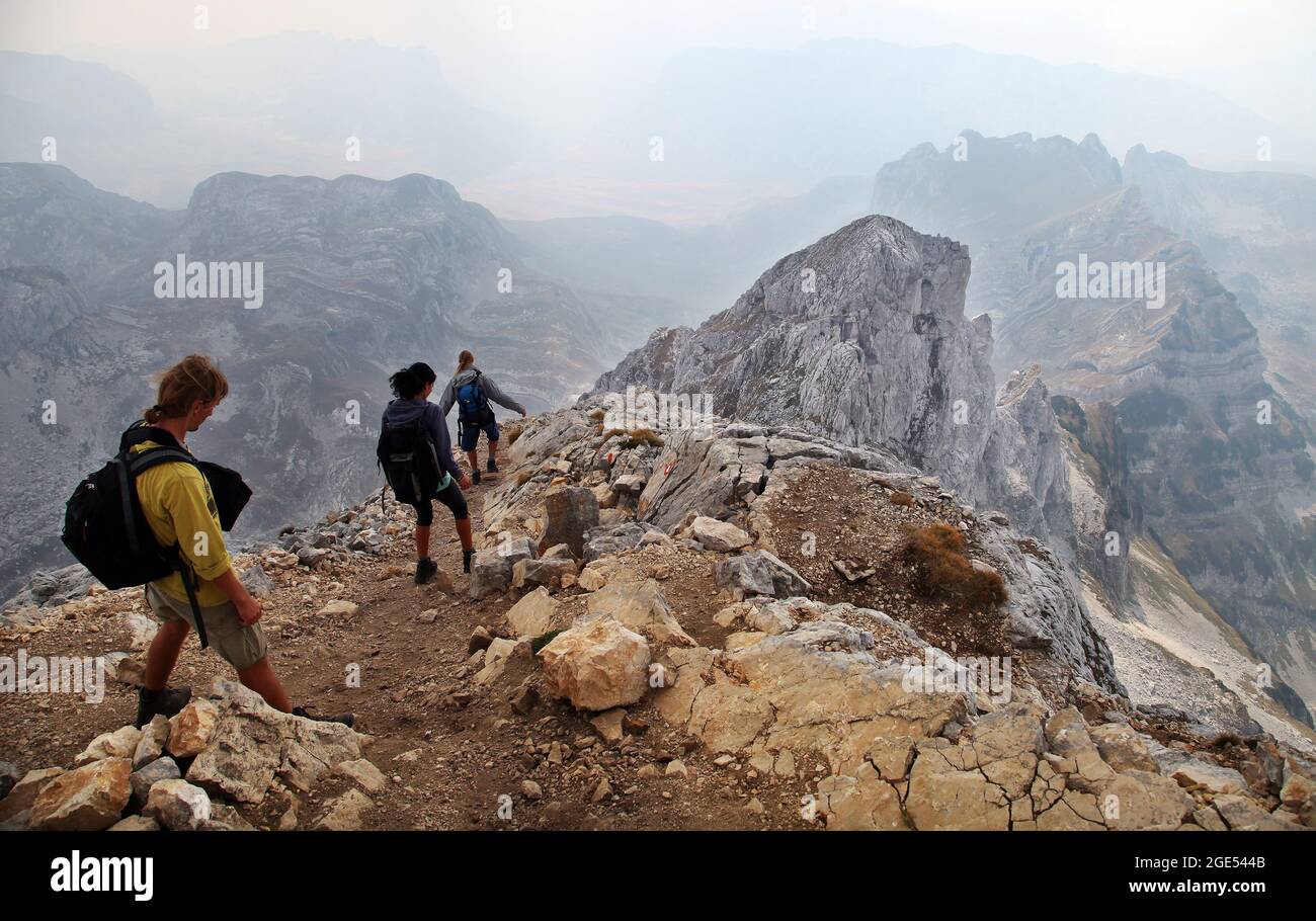 DINARIC ALPS, MONTENEGRO - SEPTEMBER 5: Mountaineers going down Mount ...