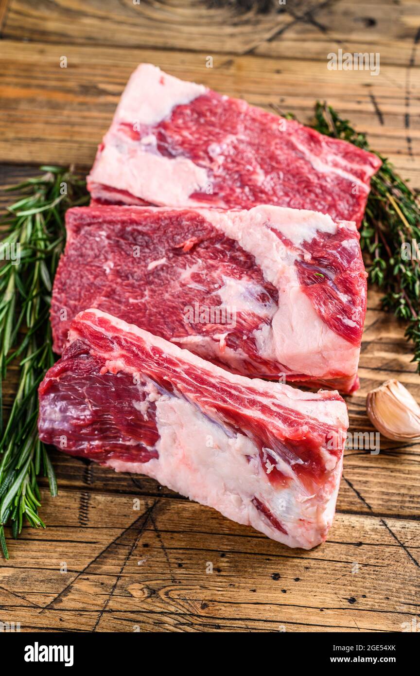 Fresh Beef short ribs on butcher wooden table. Wooden background. Top ...