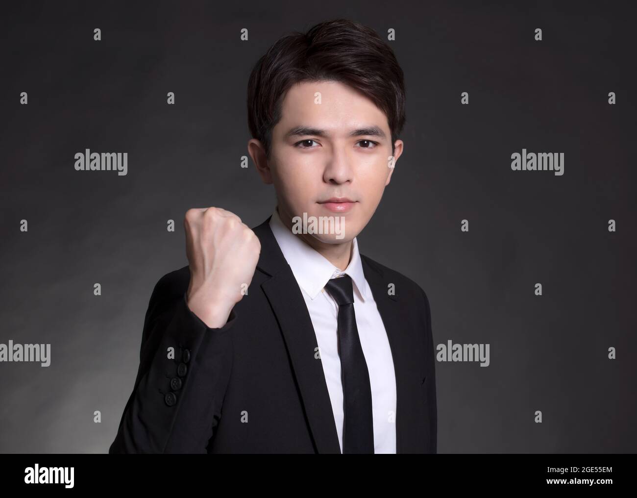 Businessman hand in black suit hi-res stock photography and images - Alamy