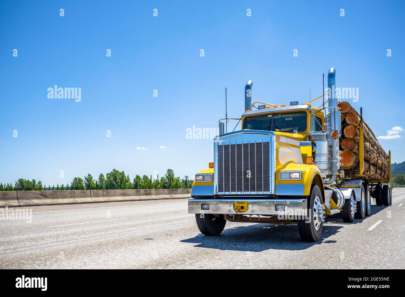 Yellow day cab big rig classic American semi truck carrier with high ...