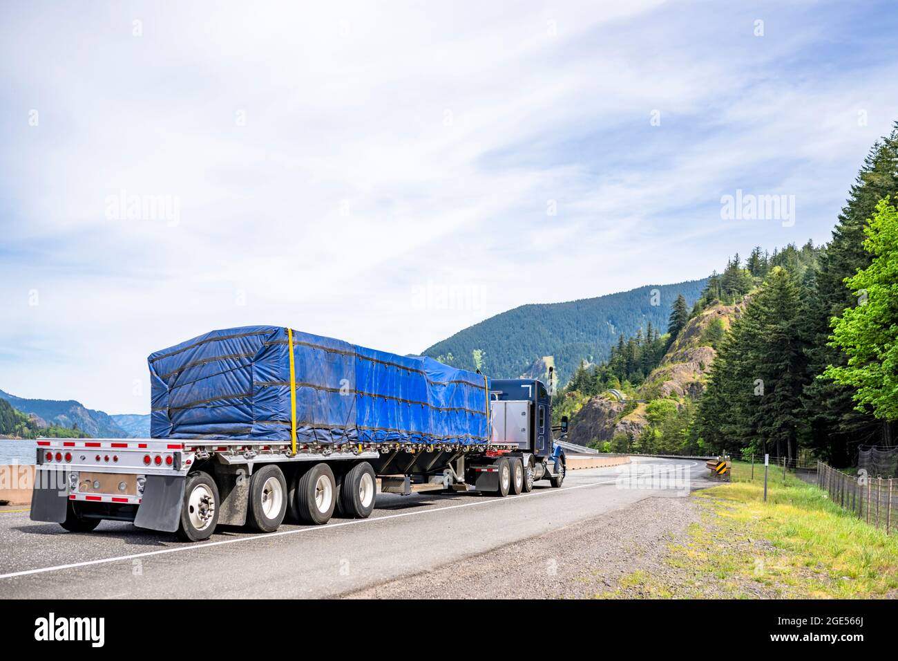 Industrial long hauler big rig blue semi truck tractor carrier ...