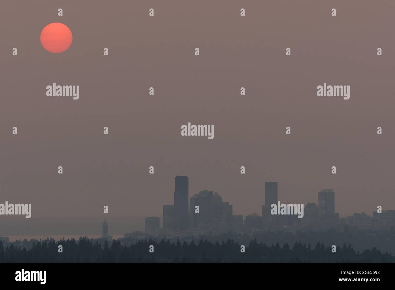 Heavy wildfire smoke surrounds Seattle with orange sun at sunset Stock ...
