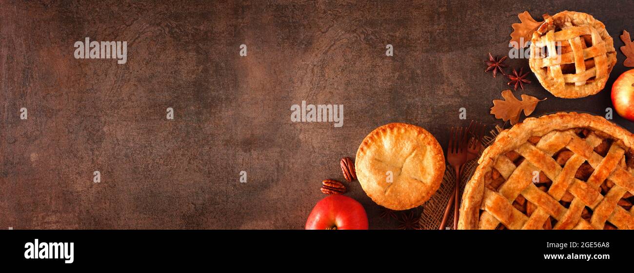 Homemade autumn apple pie corner border banner. Top view over a brown ...
