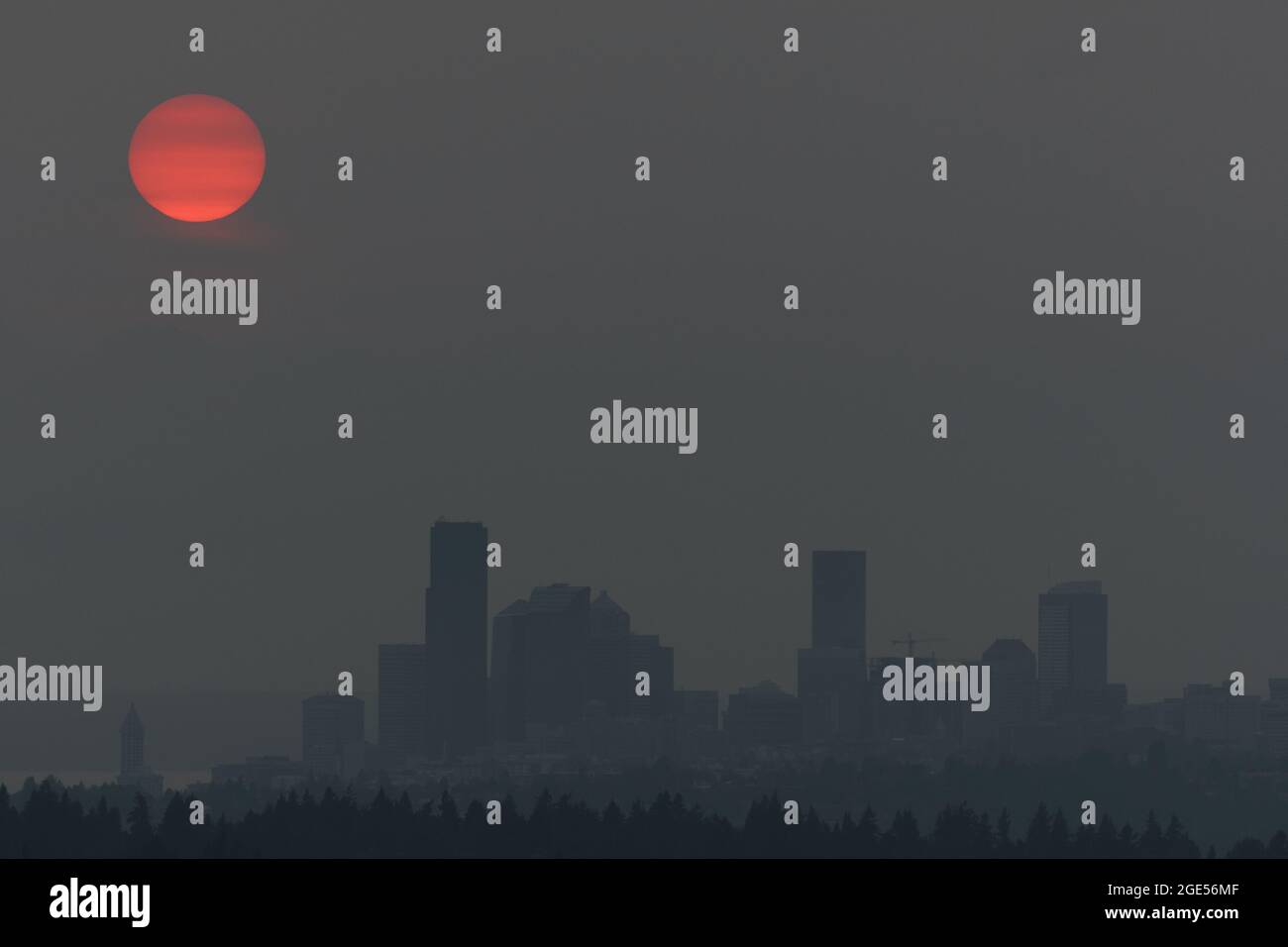 Heavy wildfire smoke surrounds Seattle with orange sun at sunset Stock ...