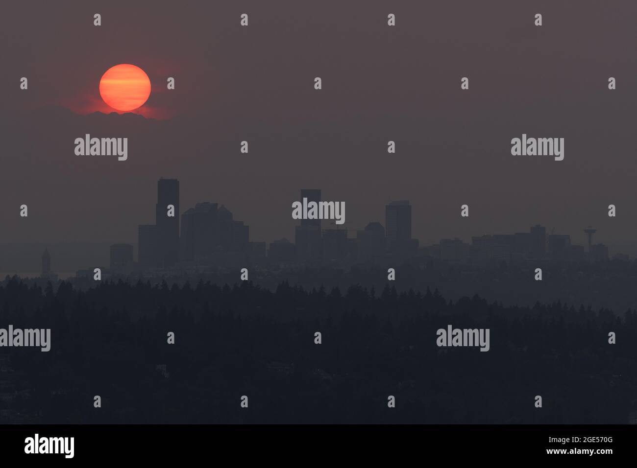 Heavy wildfire smoke surrounds Seattle with sunset behind the Olympic ...