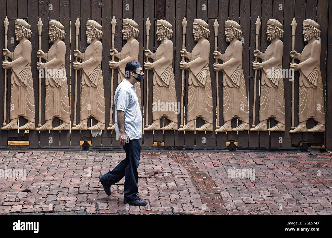 Mumbai, India. 16th Aug, 2021. A Parsi man wearing a facemask as a ...