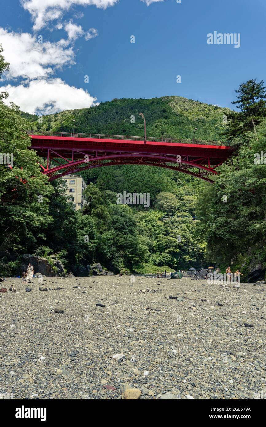 Okuma red bridge summer season in Japan. camping placed Stock Photo - Alamy
