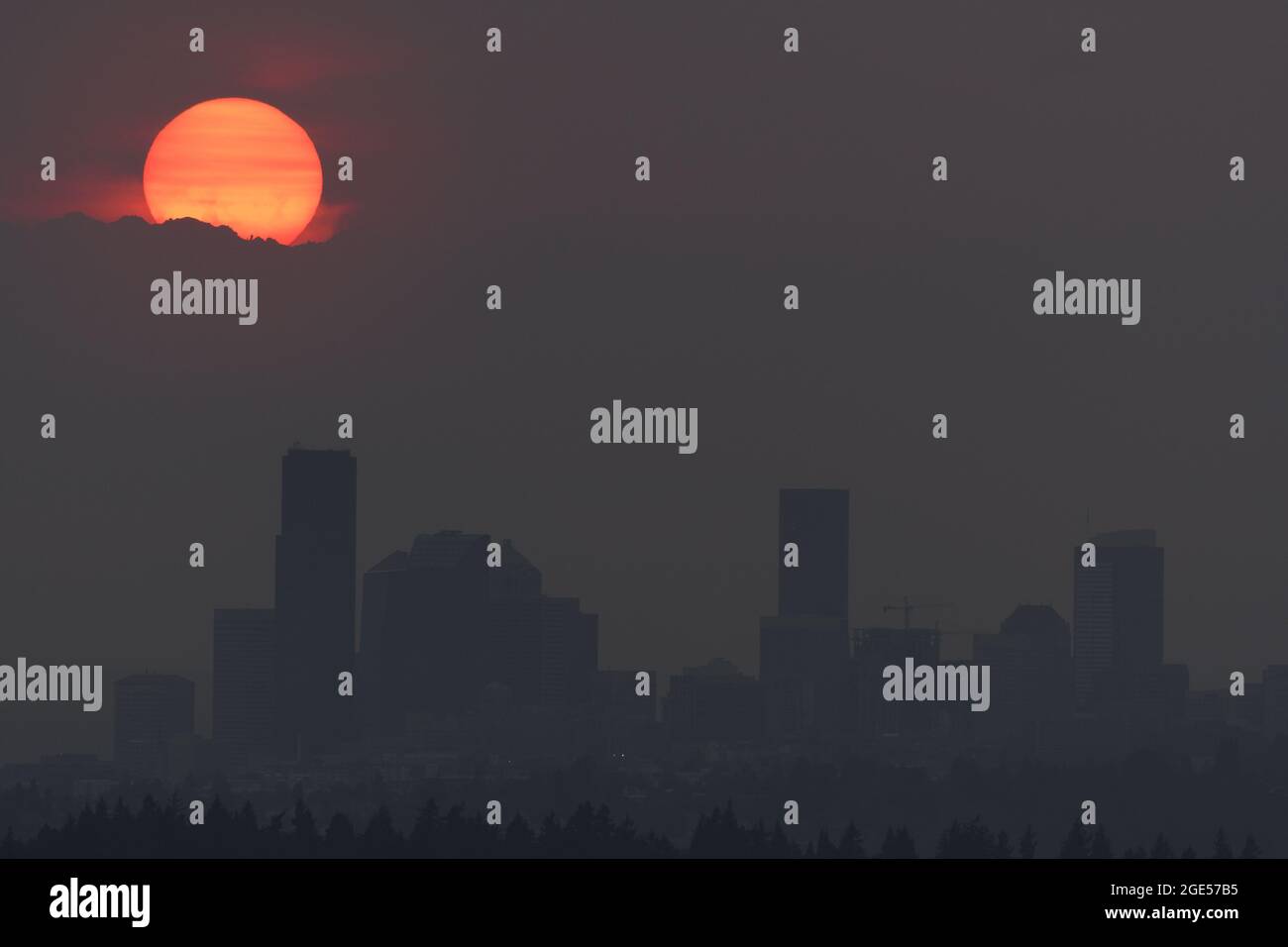 Heavy wildfire smoke surrounds Seattle with sunset behind the Olympic ...