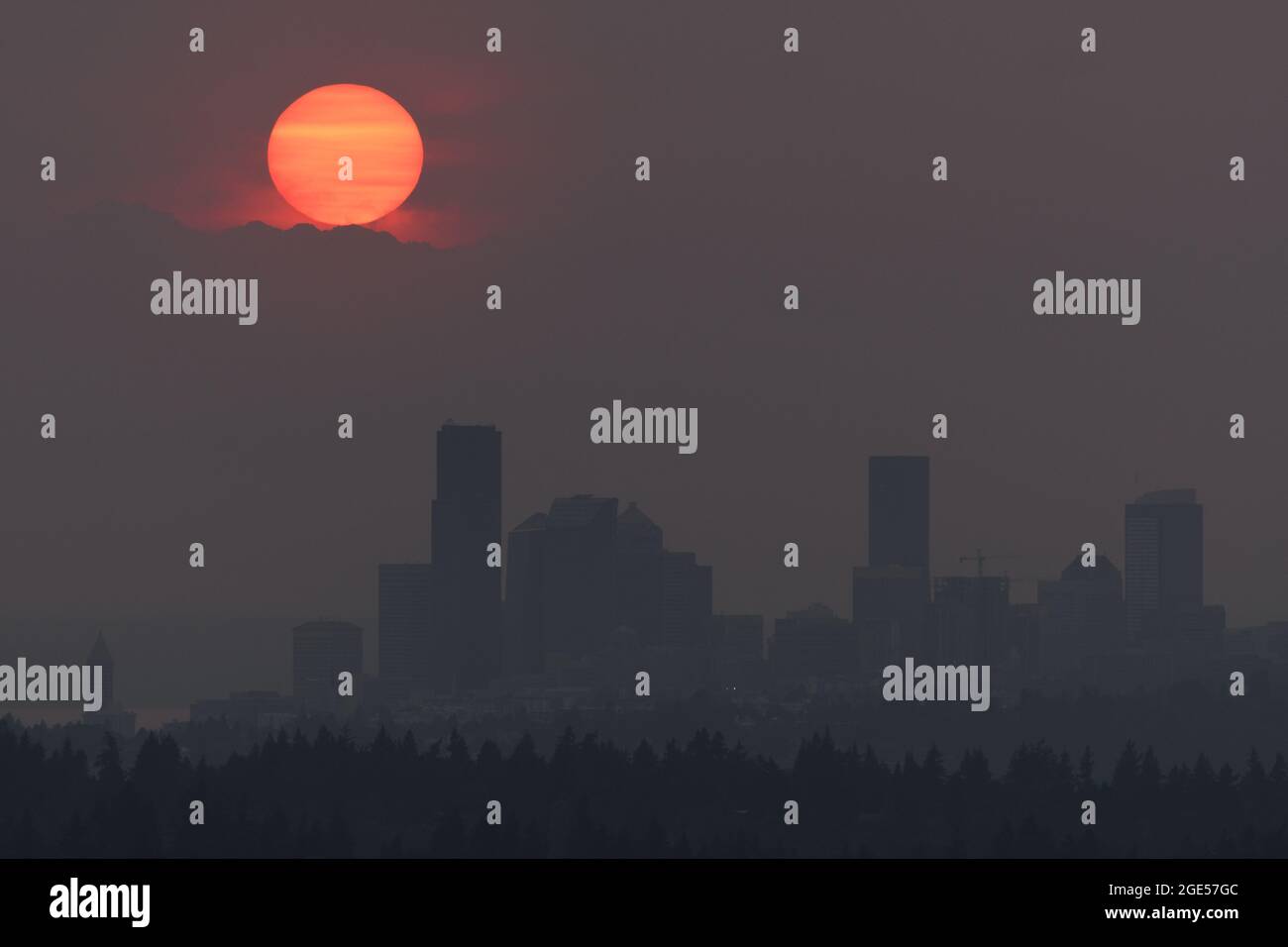 Heavy wildfire smoke surrounds Seattle with sunset behind the Olympic ...