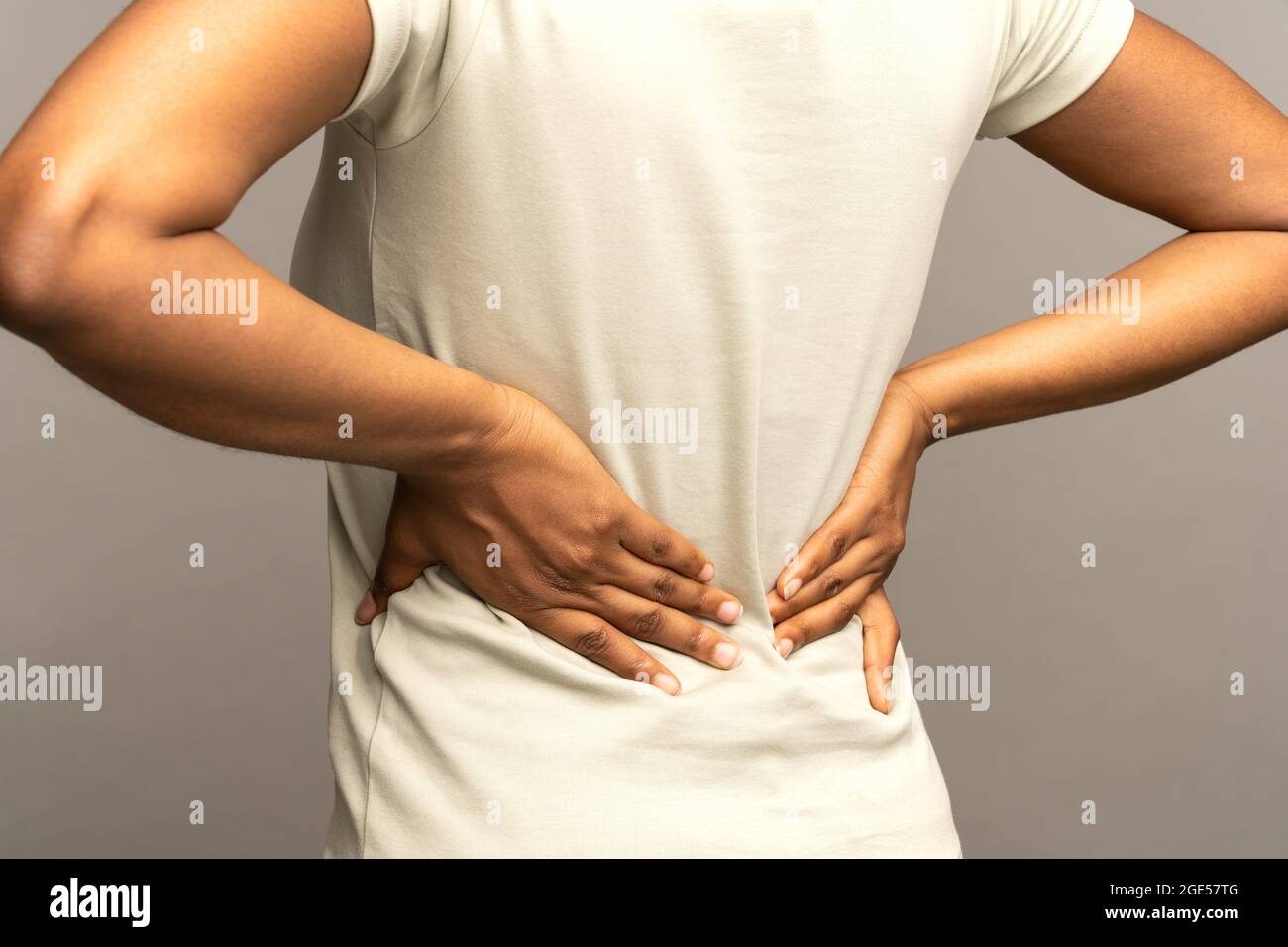 Close up of african girl suffering from back pain, arthritis ...