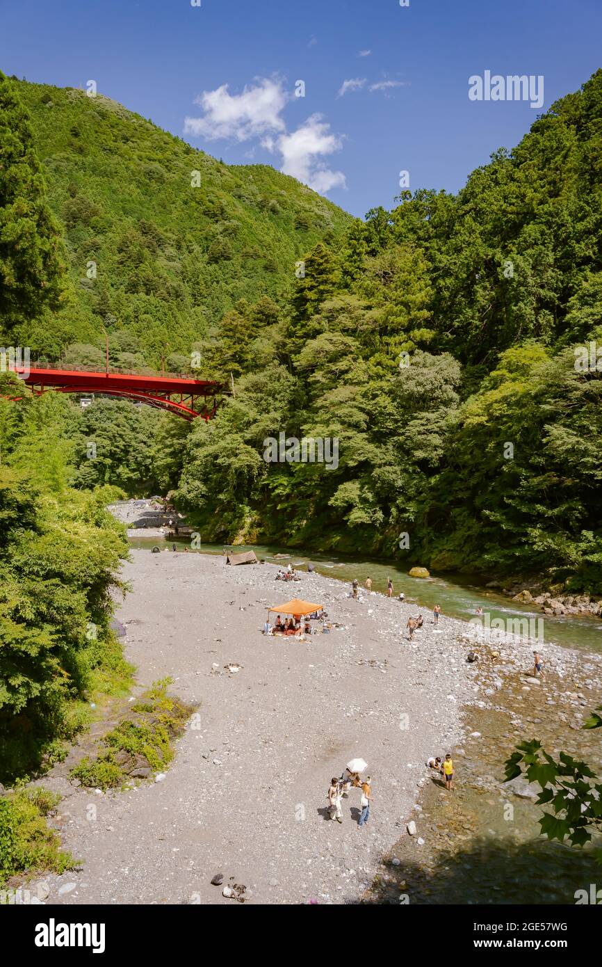 Okuma red bridge summer season in Japan. camping placed Stock Photo - Alamy
