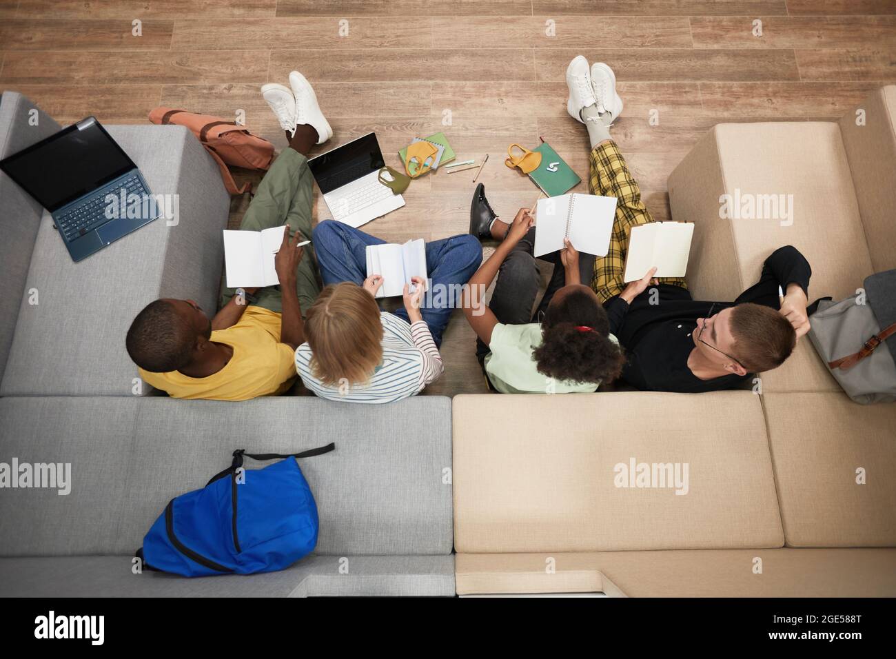 Top down view at diverse group of young students studying together ...