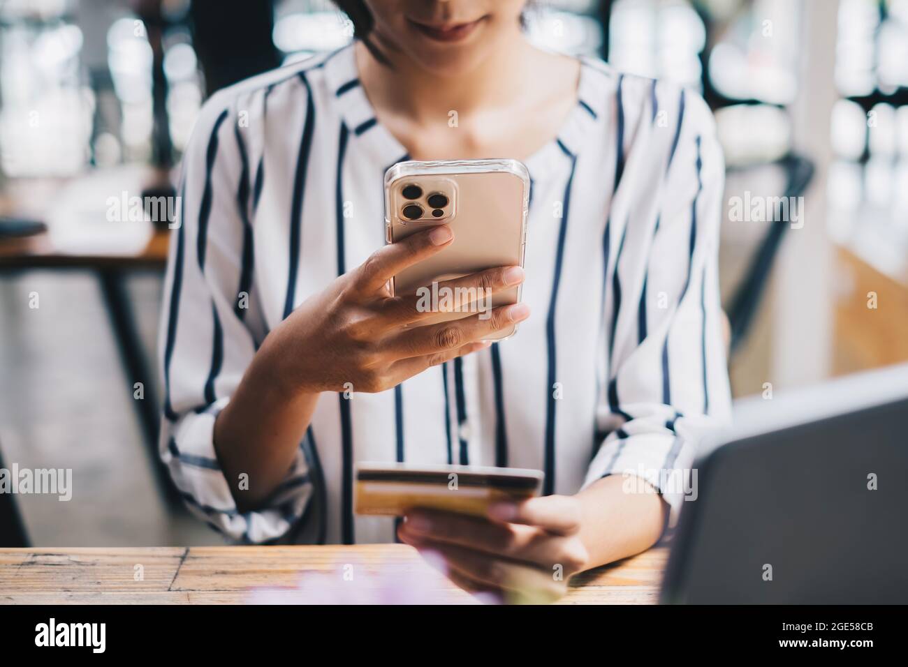 Woman Enjoy With Online Shopping Application On Cell Phone And Use Camera To Scan Credit Card woman-enjoy-with-online-shopping-application-on-cell-phone-and-use-camera-to-scan-credit-card