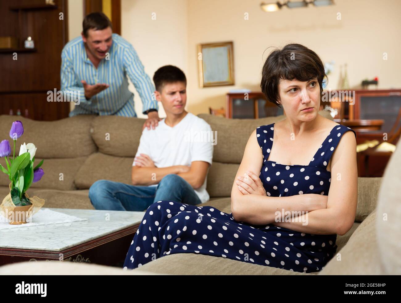 Parents quarrel with teenage son Stock Photo - Alamy
