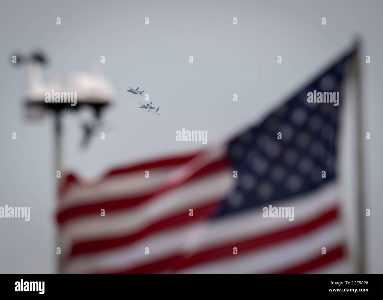 A formation of an F-35A Lightning II and an A-10 Thunderbolt II fly ...