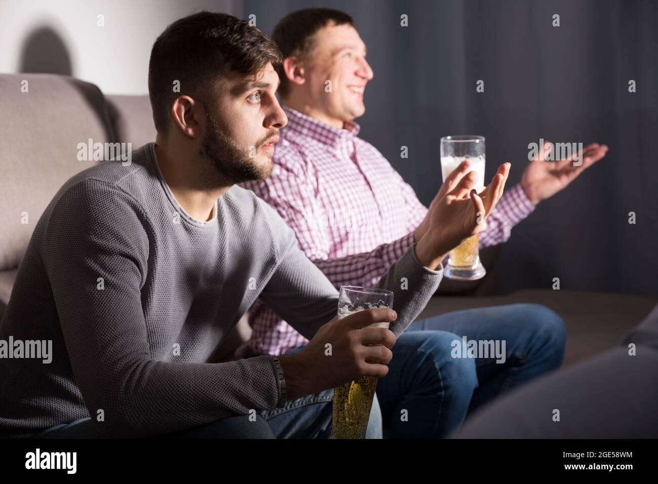 Two friends supporting different teams Stock Photo - Alamy