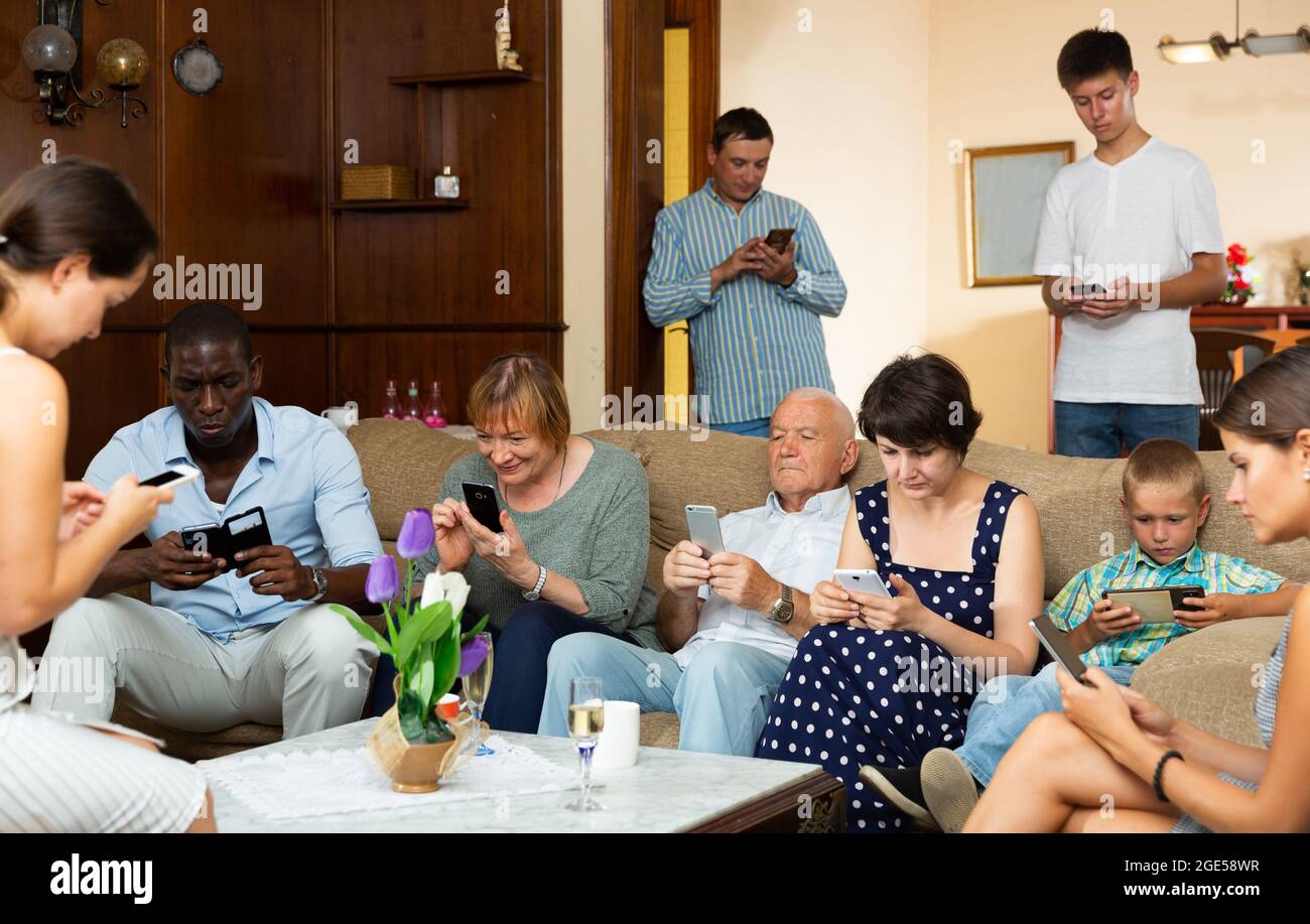Large family with mobile devices Stock Photo - Alamy
