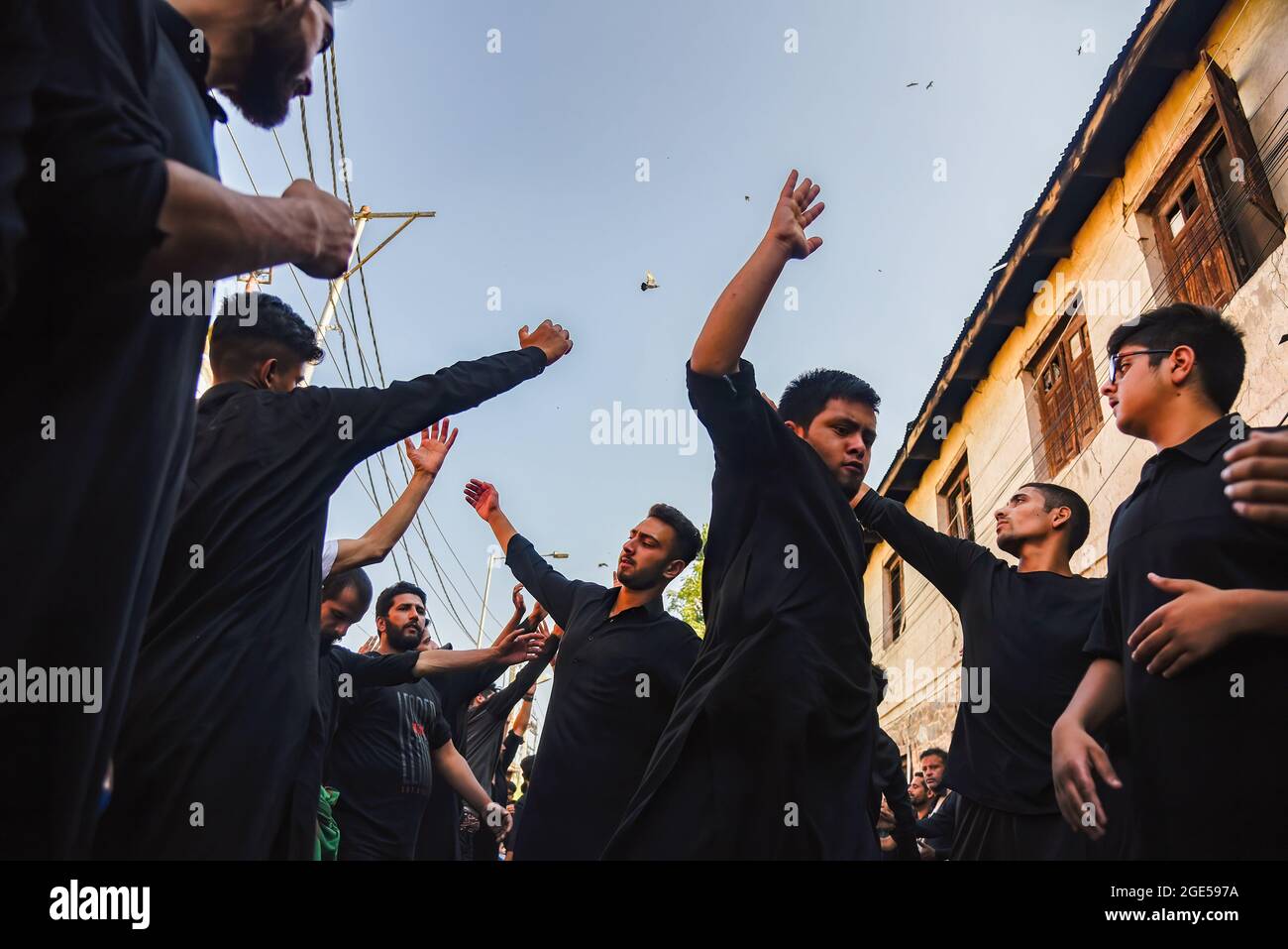 Srinagar, India. 16th Aug, 2021. Kashmiri Shia Muslims seen dancing ...