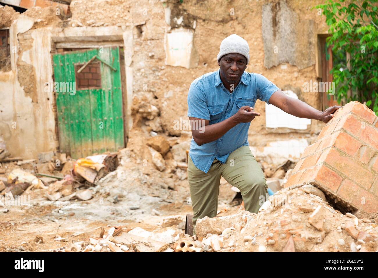 Man is standing among the ruins Stock Photo - Alamy