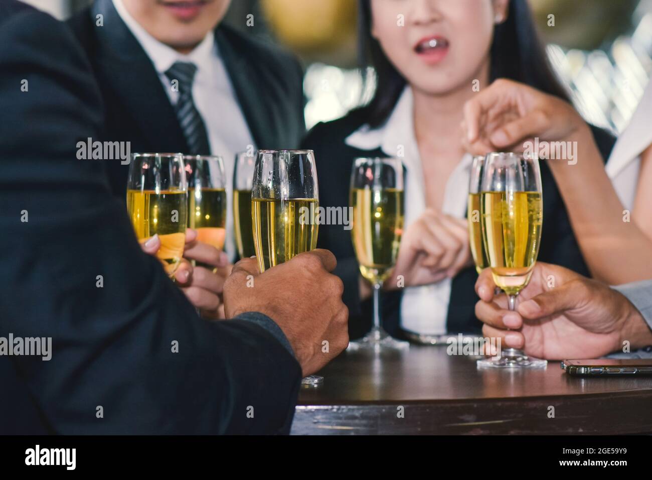 Employees have a drink to celebrate at a corporate party Stock Photo ...