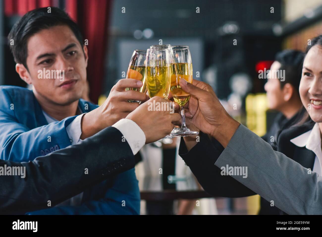 Employees have a drink to celebrate at a corporate party Stock Photo ...