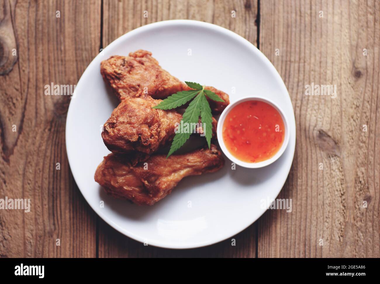 Crispy fried chicken food with cannabis leaf - marijuana leaves plant ...