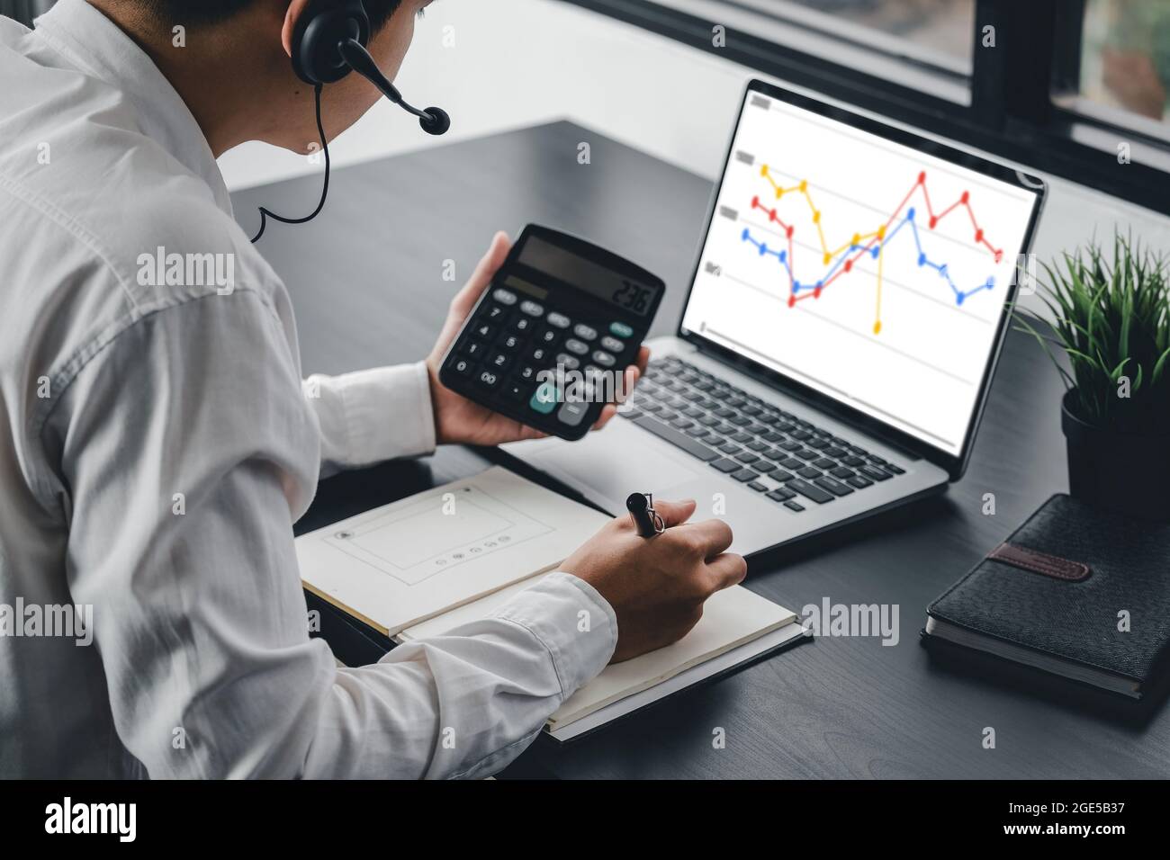 Accountant using a calculator to calculate the numbers. Accounting ...