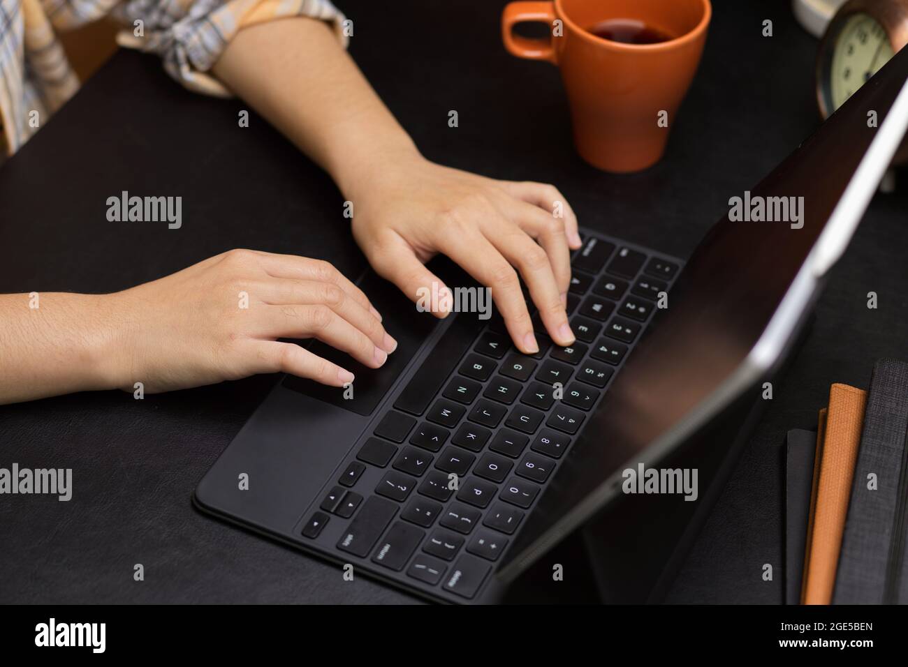 Female college student doing homework on smart tablet, online class ...