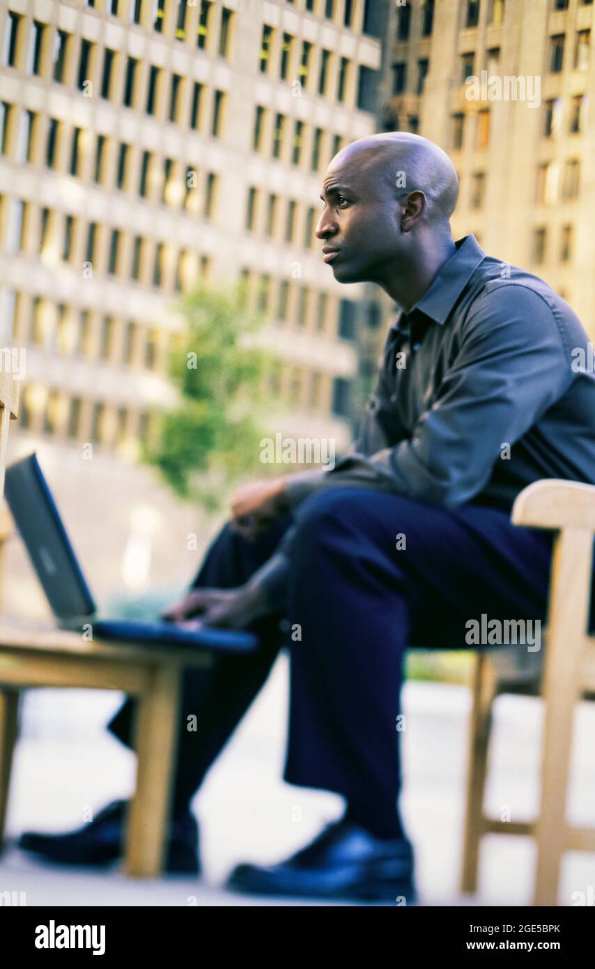 Business man with laptop computer, downtown Seattle Stock Photo - Alamy