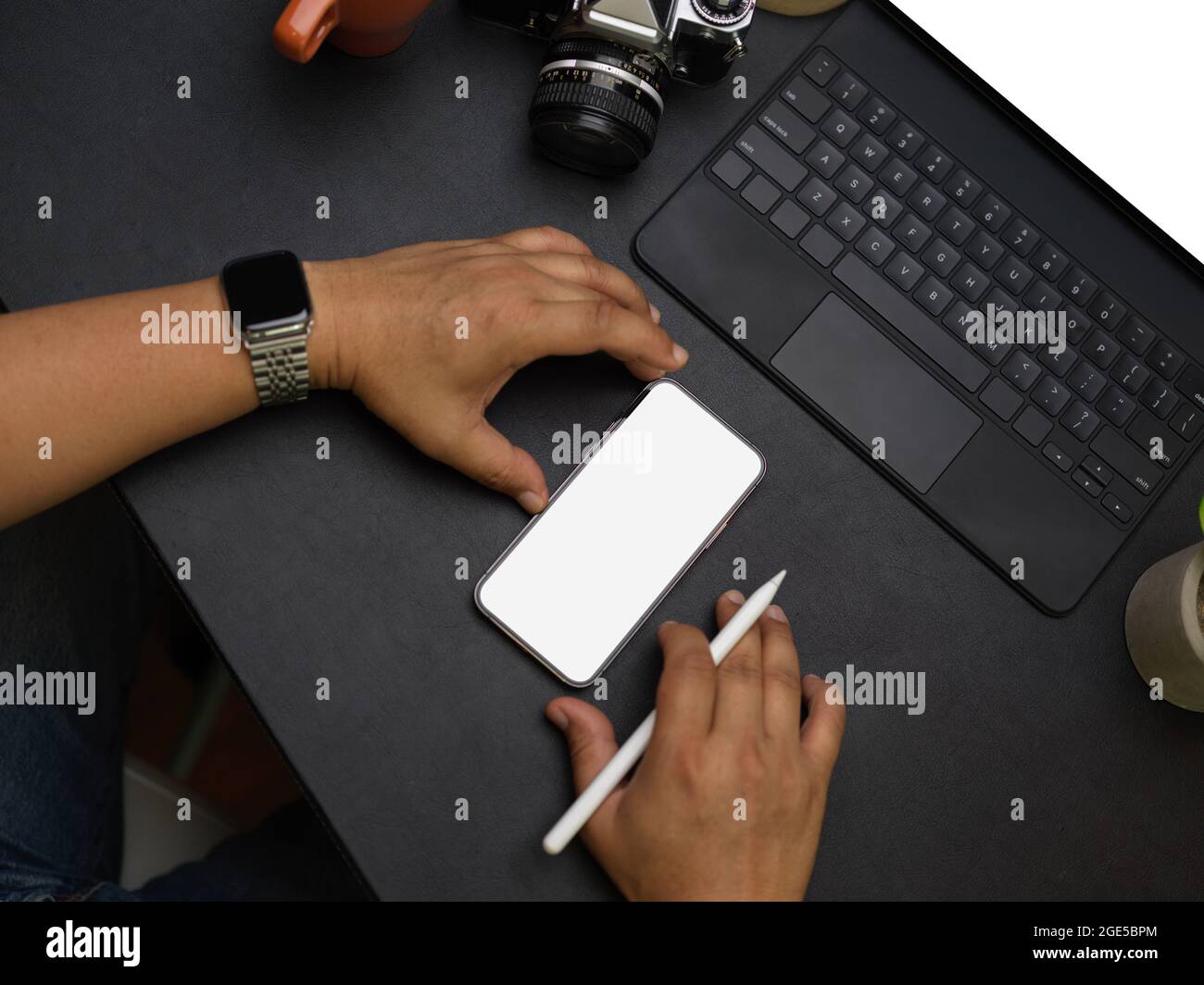 Closeup middle aged male photographer using modern mobile phone and ...