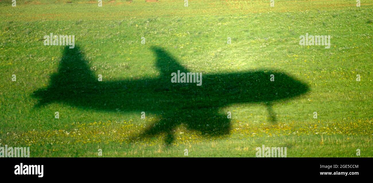 Airplane shadow while landing Stock Photo - Alamy