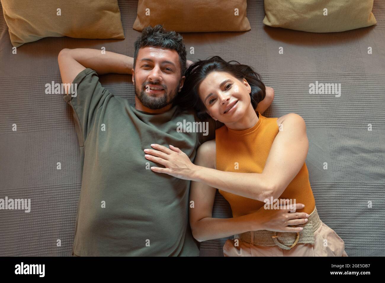 Amorous couple lying in bed hi-res stock photography and images - Alamy