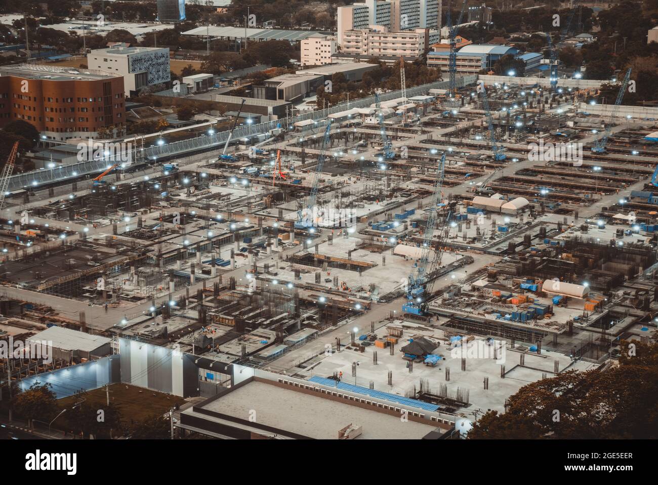 Large construction site with heavy construction machinery in metropolis ...