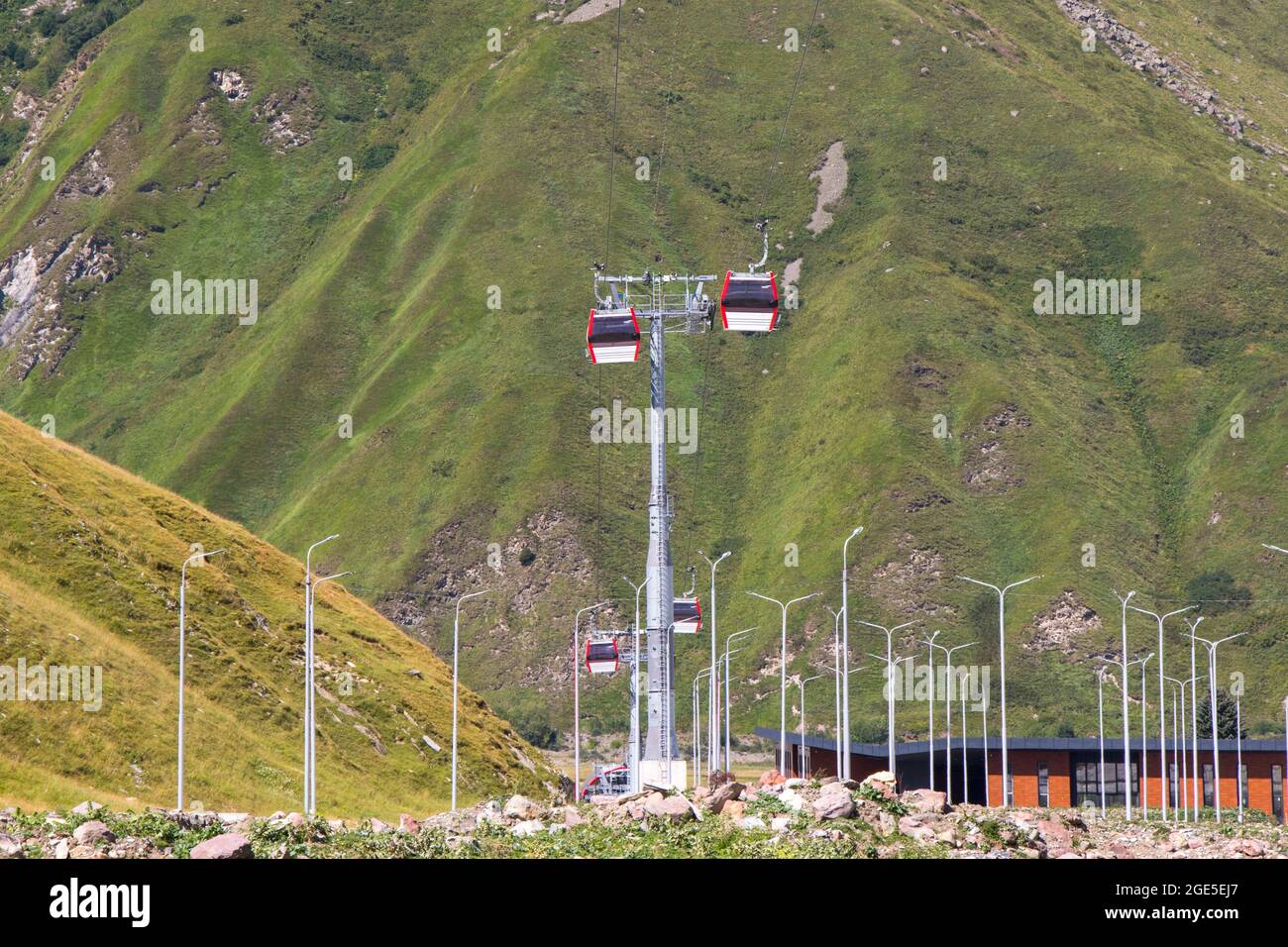 Air cabin and gondola lift transport, mountains and sunlight in Georgia ...
