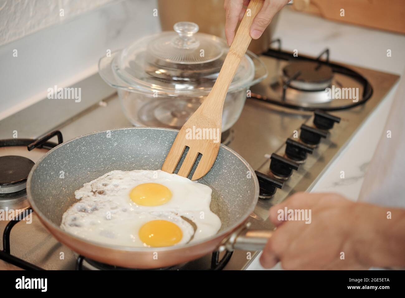 Man frying egg hi-res stock photography and images - Alamy