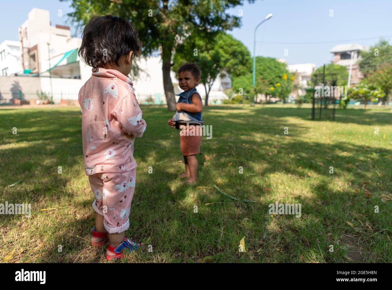 Indian children playing in trees hi-res stock photography and images ...