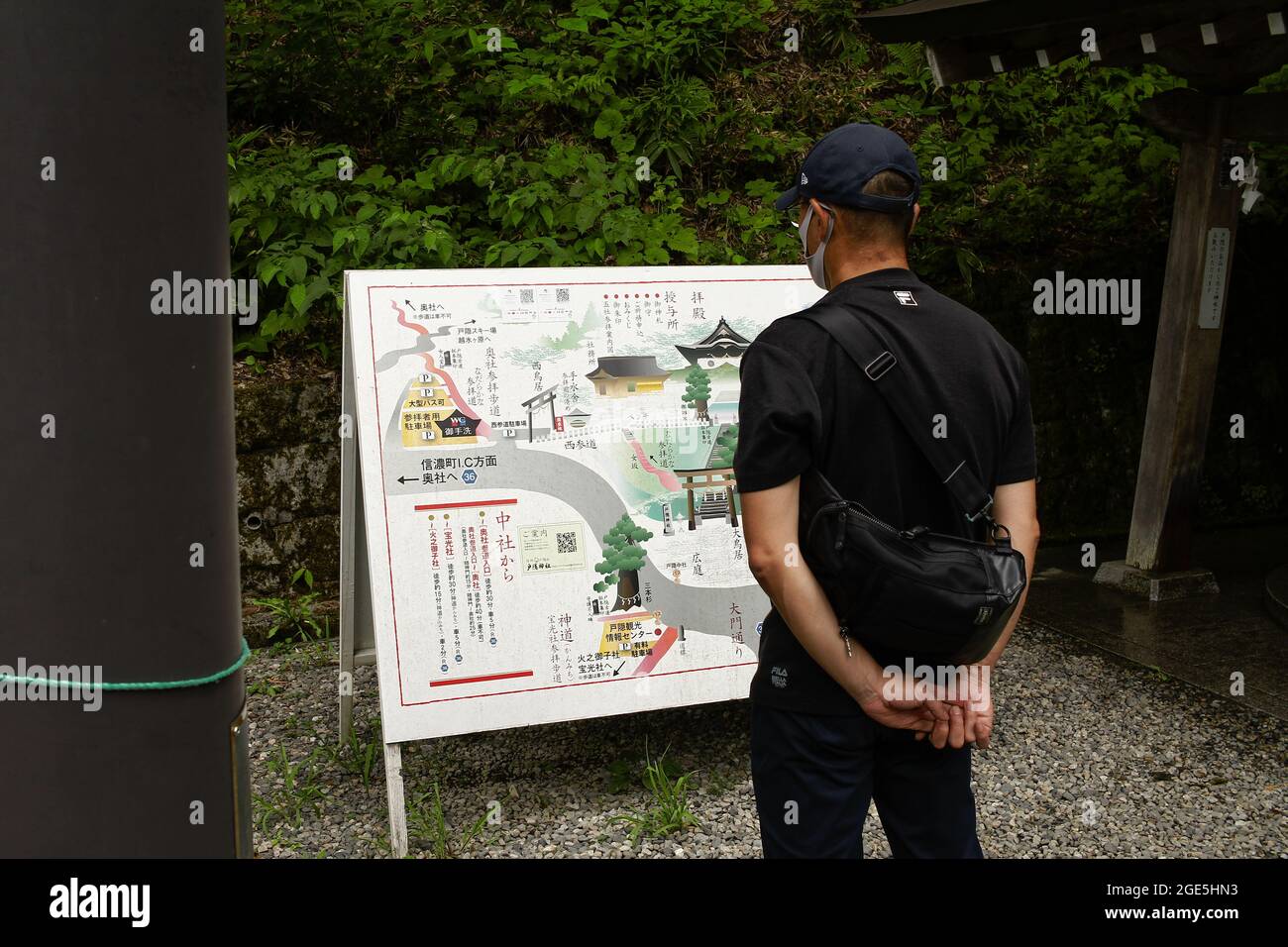 Nagano, Japan, 2021-12-08 , Man looking at the map of the Togakushi ...