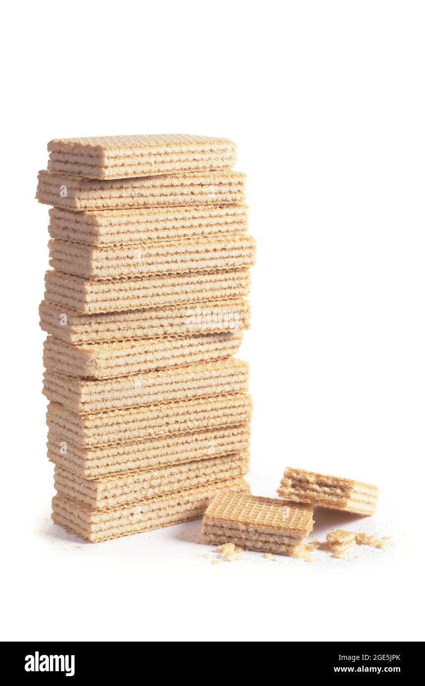 Stack of whole wafers and two half with crumbs on a white background ...