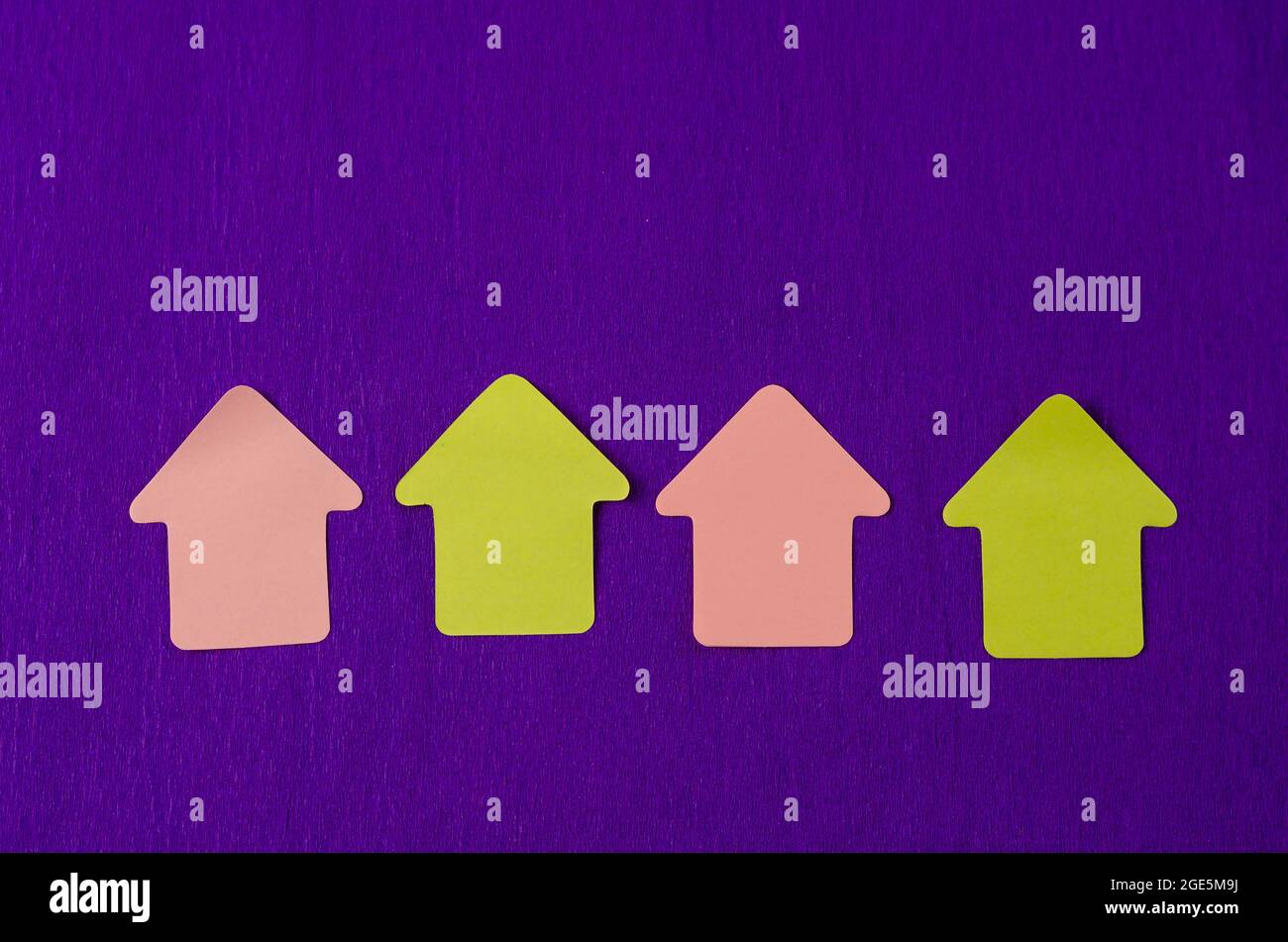 Paper sticky notes in shape of arrow on lilac background. Pink and ...