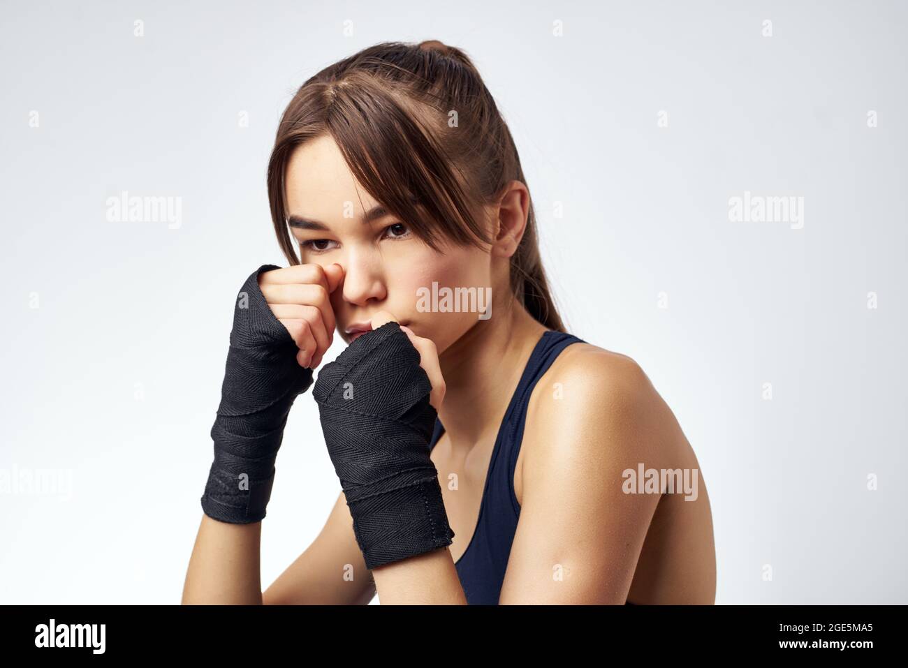 woman sporting boxing bandages rack kickboxing exercise Stock Photo - Alamy