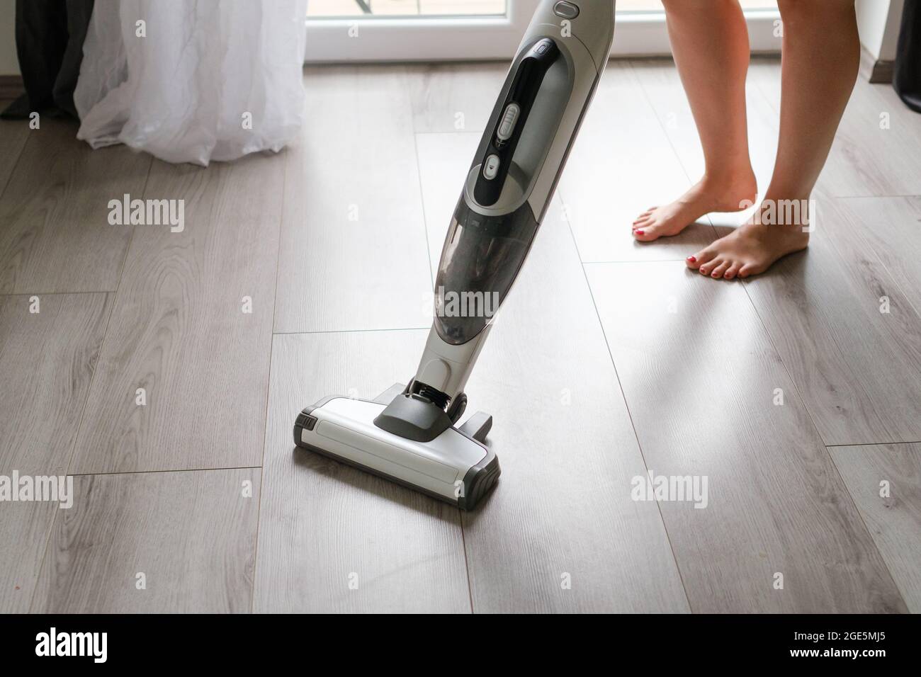 Woman vacuuming in living room hi-res stock photography and images - Alamy